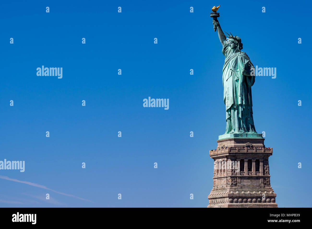 Statue of liberty isolated on deep blue sky background Stock Photo - Alamy