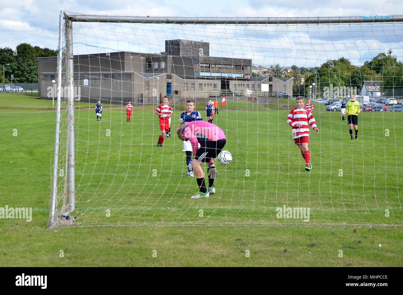 GLASGOW, SCOTLAND- AUGUST 24th 2014: A football goes between the legs ...