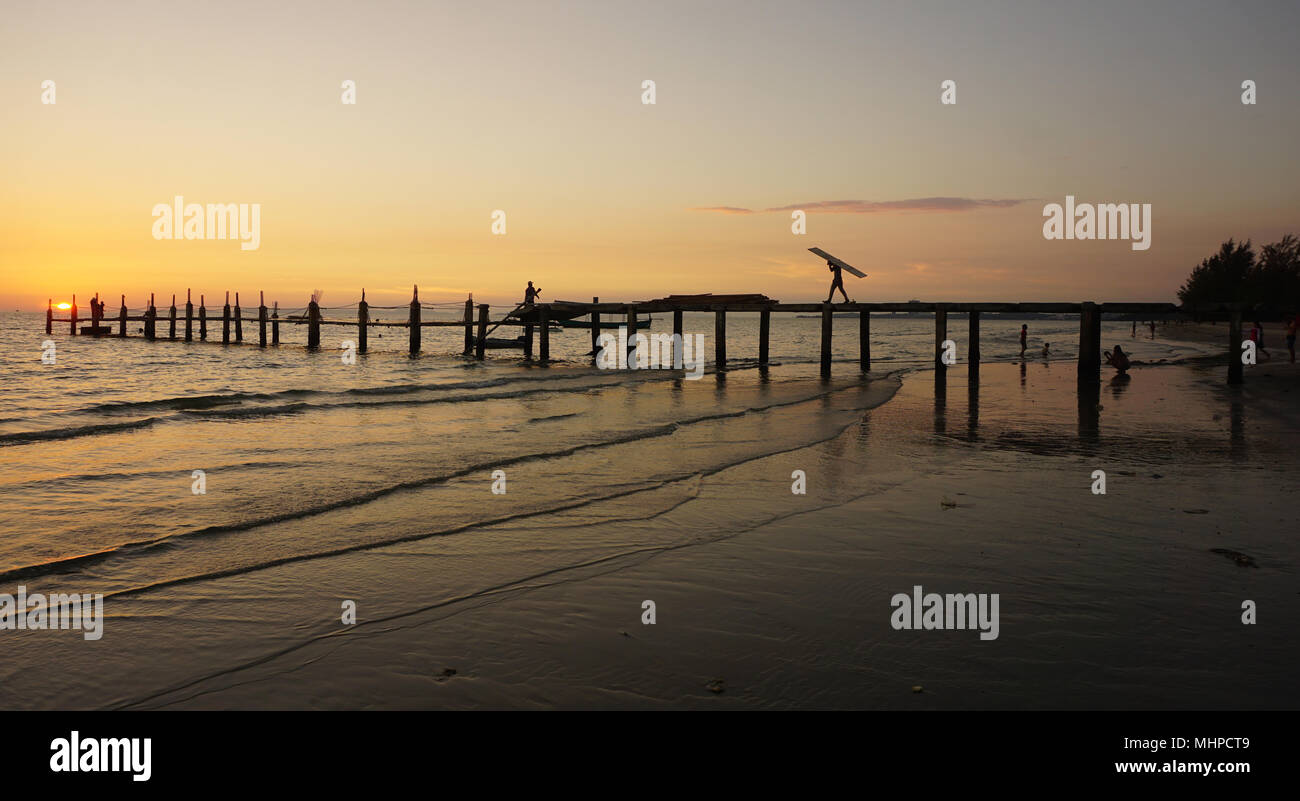 wooden jetty on otre beach at the sunset Stock Photo - Alamy