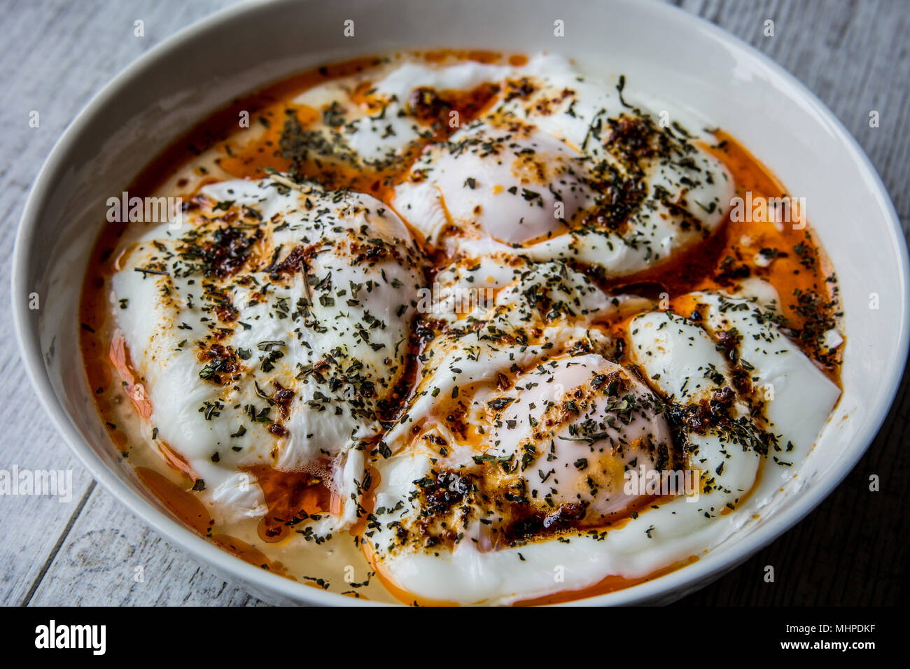 Cilbir is a Turkish dish of poached eggs with yogurt Stock Photo - Alamy