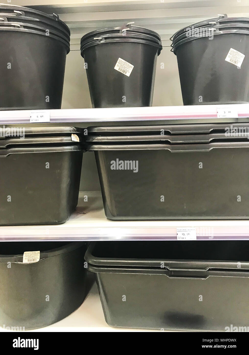 Plastic buckets on shelves. Studio Photo Stock Photo - Alamy