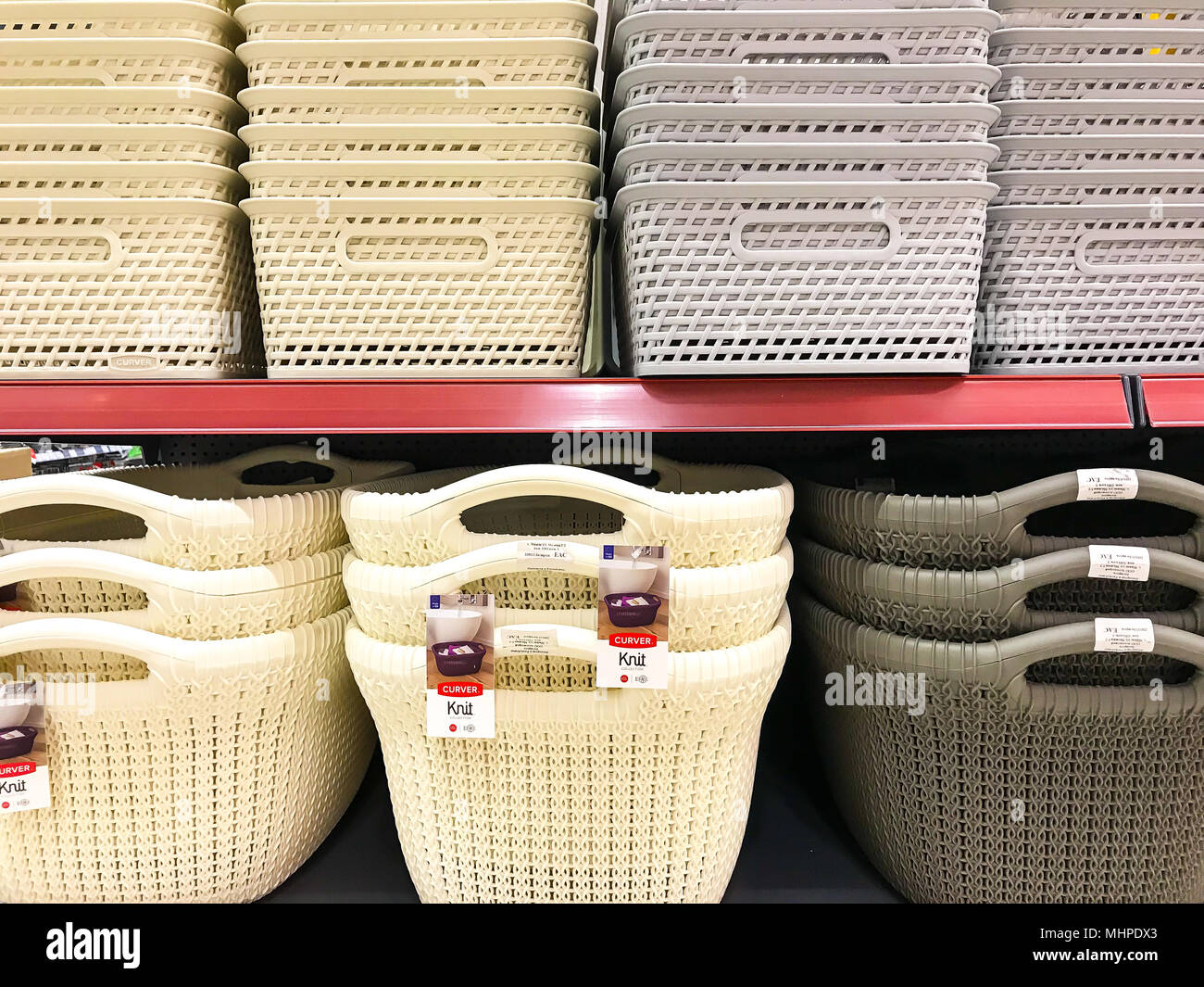 Plastic buckets on shelves. Studio Photo Stock Photo - Alamy