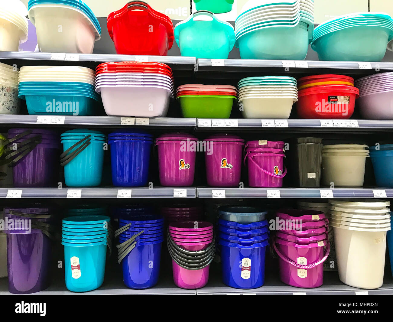 Plastic buckets on shelves. Studio Photo Stock Photo - Alamy