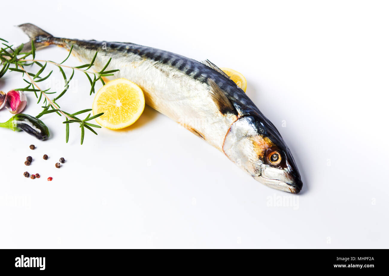 Raw mackerel fish with spices isolated on white background Stock Photo ...