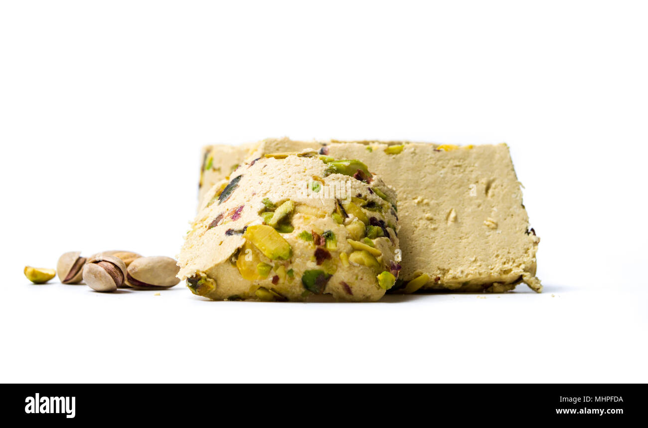 Halva with pistachio isolated on white background Stock Photo - Alamy