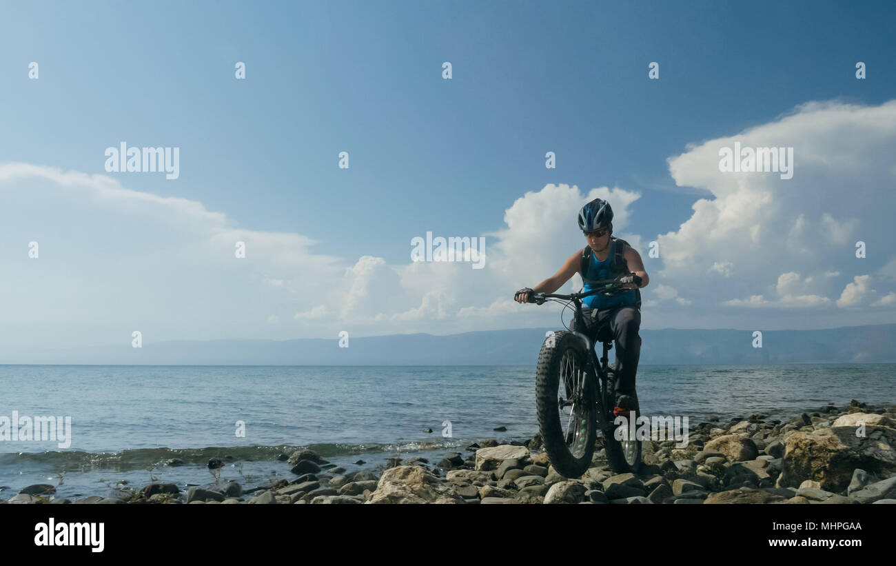 Fat bike also called fatbike or fat-tire bike in summer driving on the ...