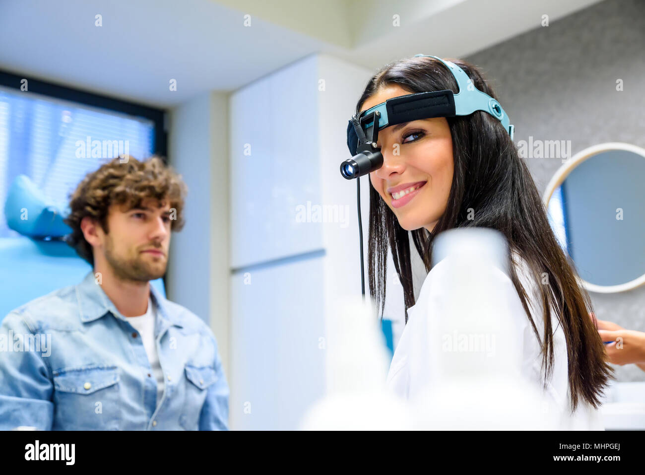 A female Ear-Nose-Throat aka ENT specialist doctor preparing for a ...