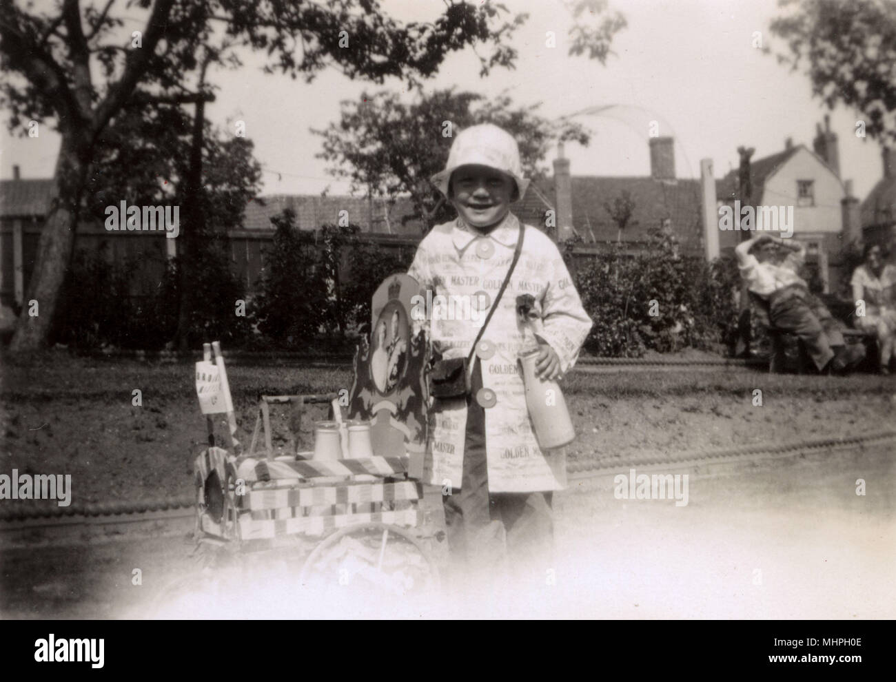 Little girl dressed up as a milk delivery person Stock Photo - Alamy
