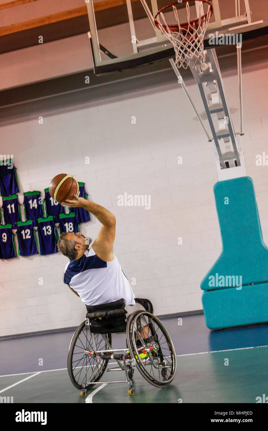 disabled sport men in action while playing indoor basketball at a ...