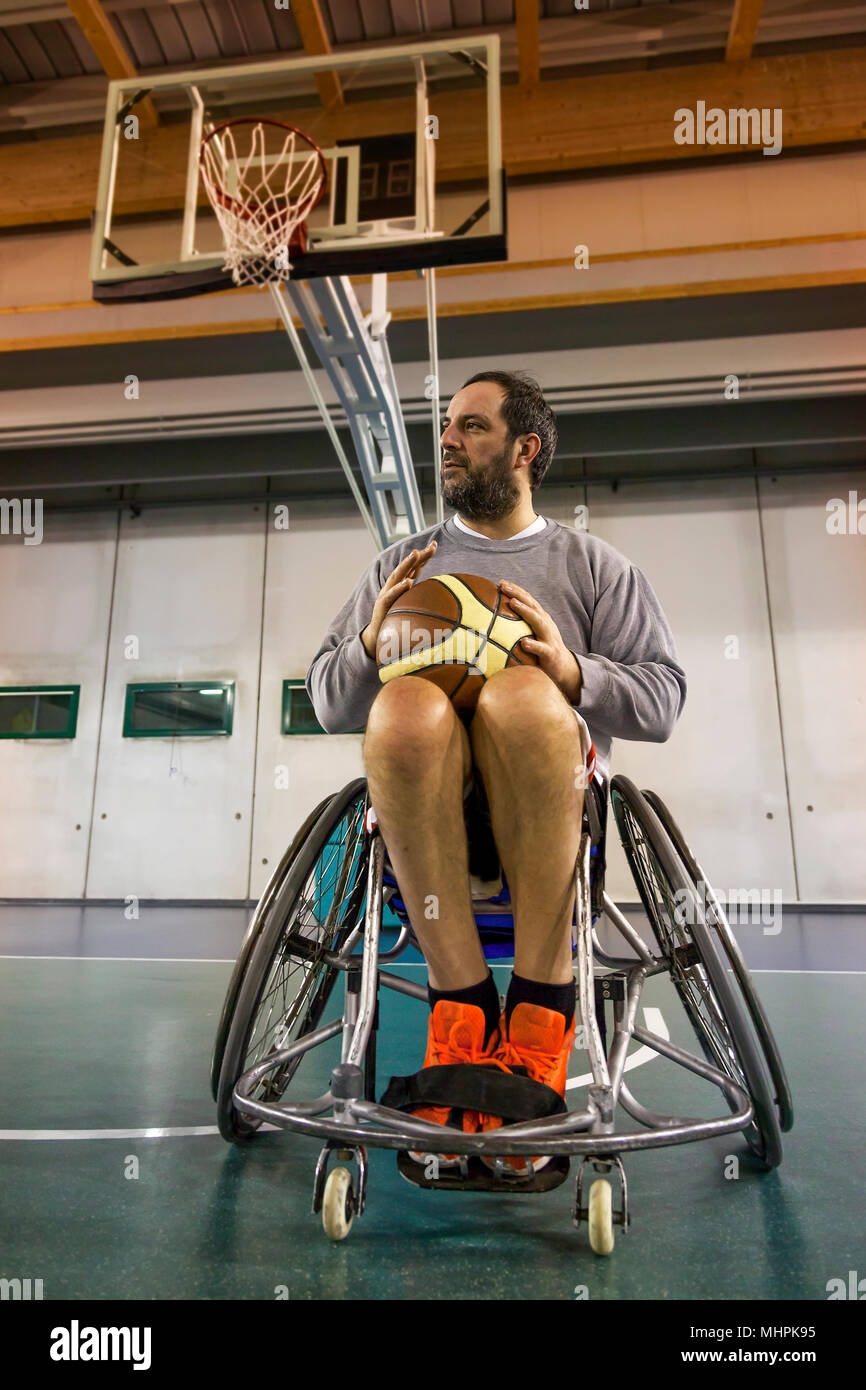 Disabled Sport Men In Action While Playing Indoor Basketball At A disabled-sport-men-in-action-while-playing-indoor-basketball-at-a