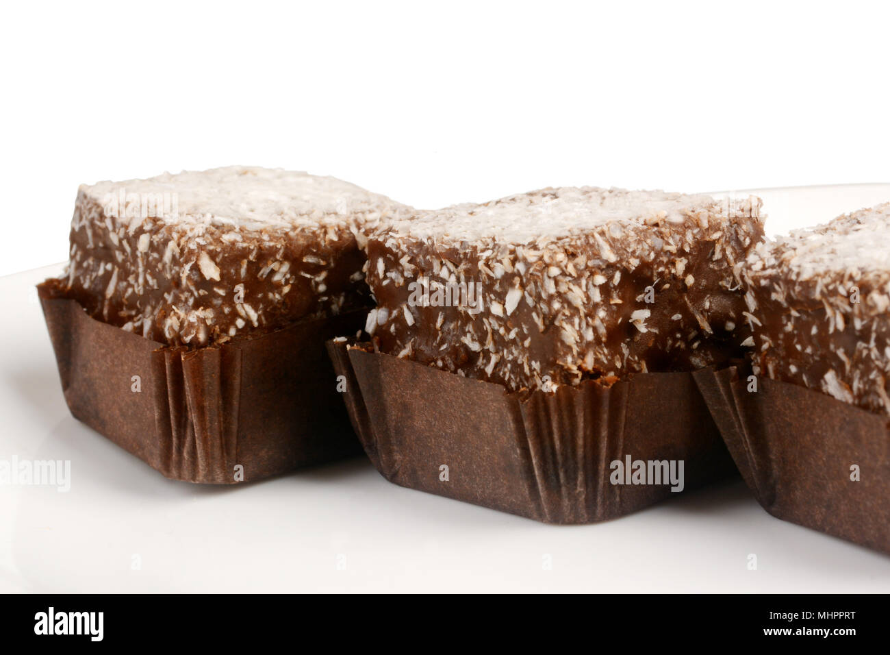 Chocolate cube shaped cookies powdered with sugar Stock Photo - Alamy