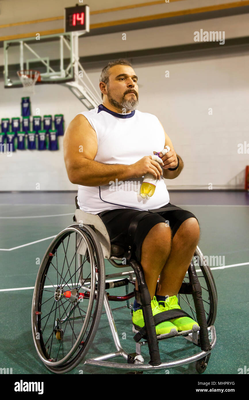 disabled sport men relaxation while playing indoor basketball at a ...