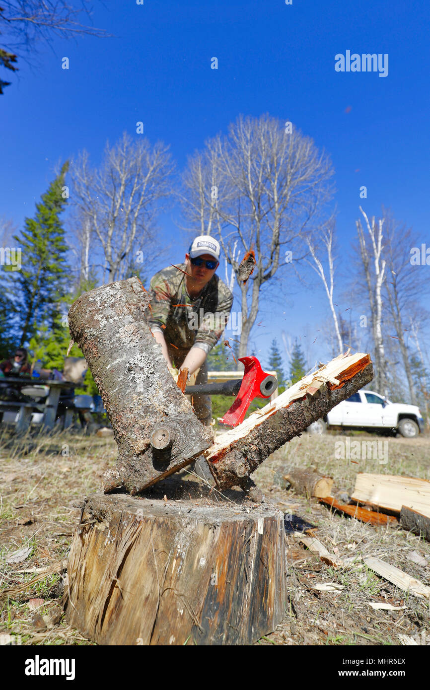Man cutting firewood ax hi-res stock photography and images - Alamy