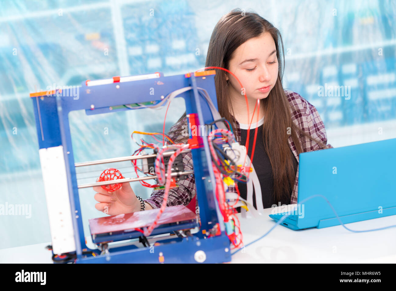 Girl schoolgirl with a 3D printer Stock Photo - Alamy