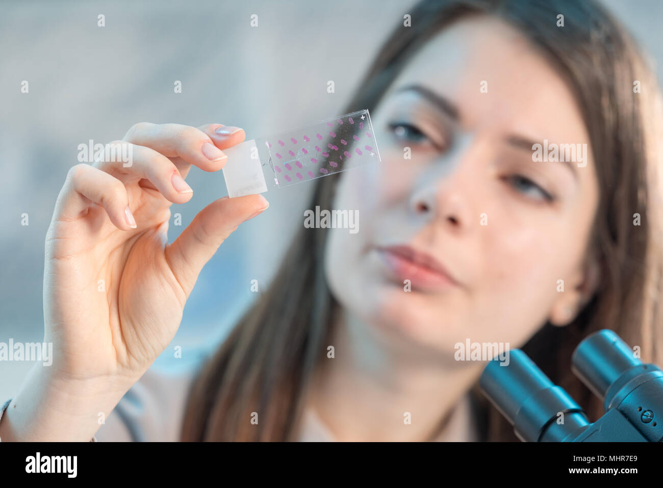 Girl with a slide for the microscope University Hospital Stock Photo ...