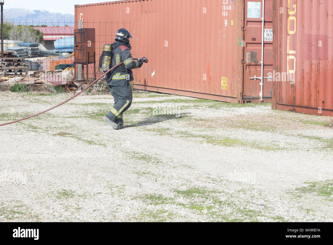 Firefighter putting out fire training station extinguisher backdraft ...