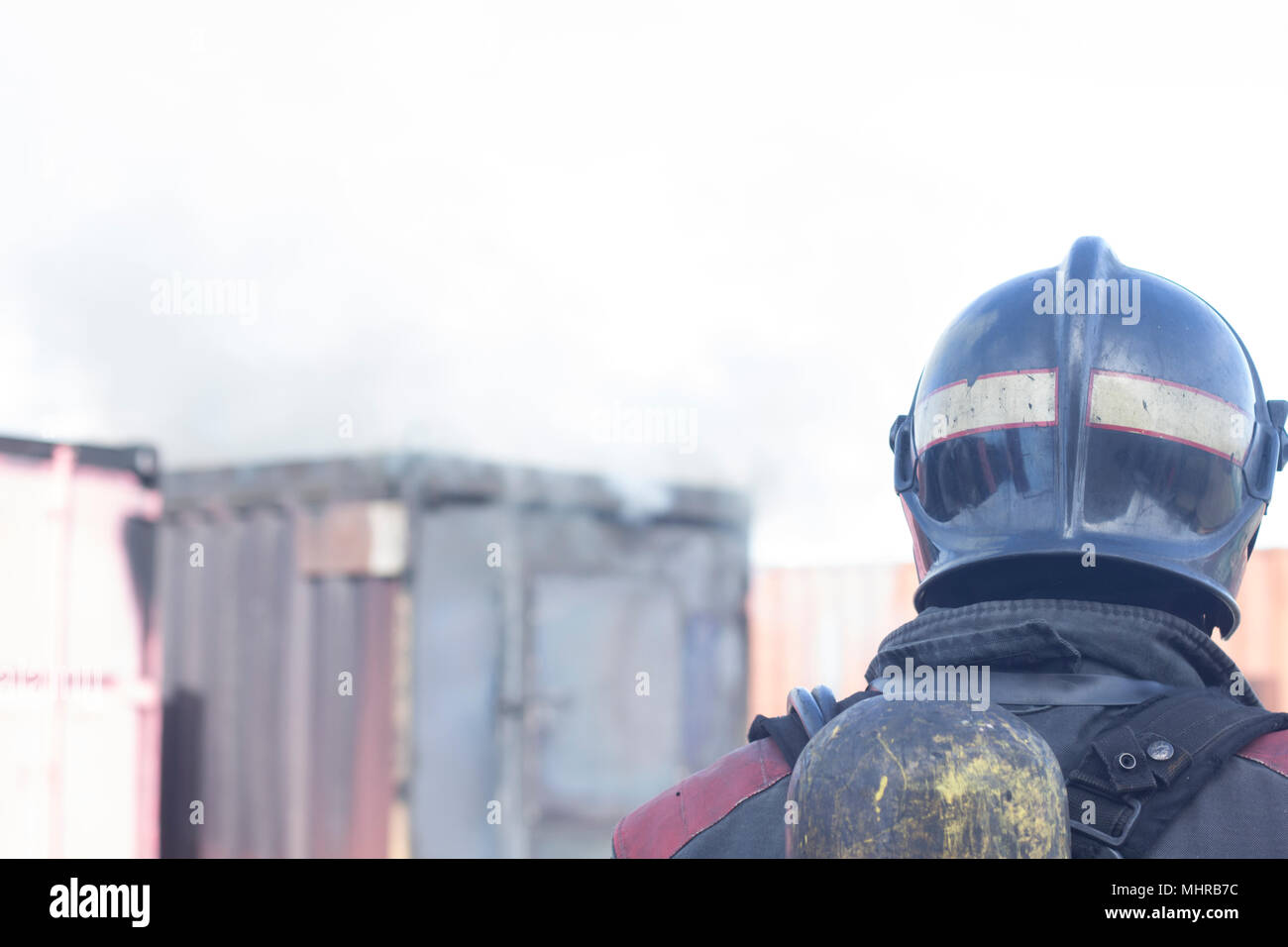 Firefighter putting out fire training station extinguisher backdraft ...