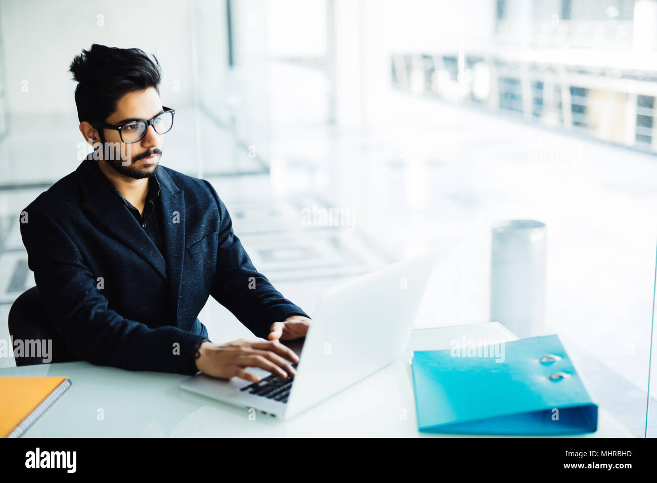 indian man working on laptop in modern office Stock Photo - Alamy