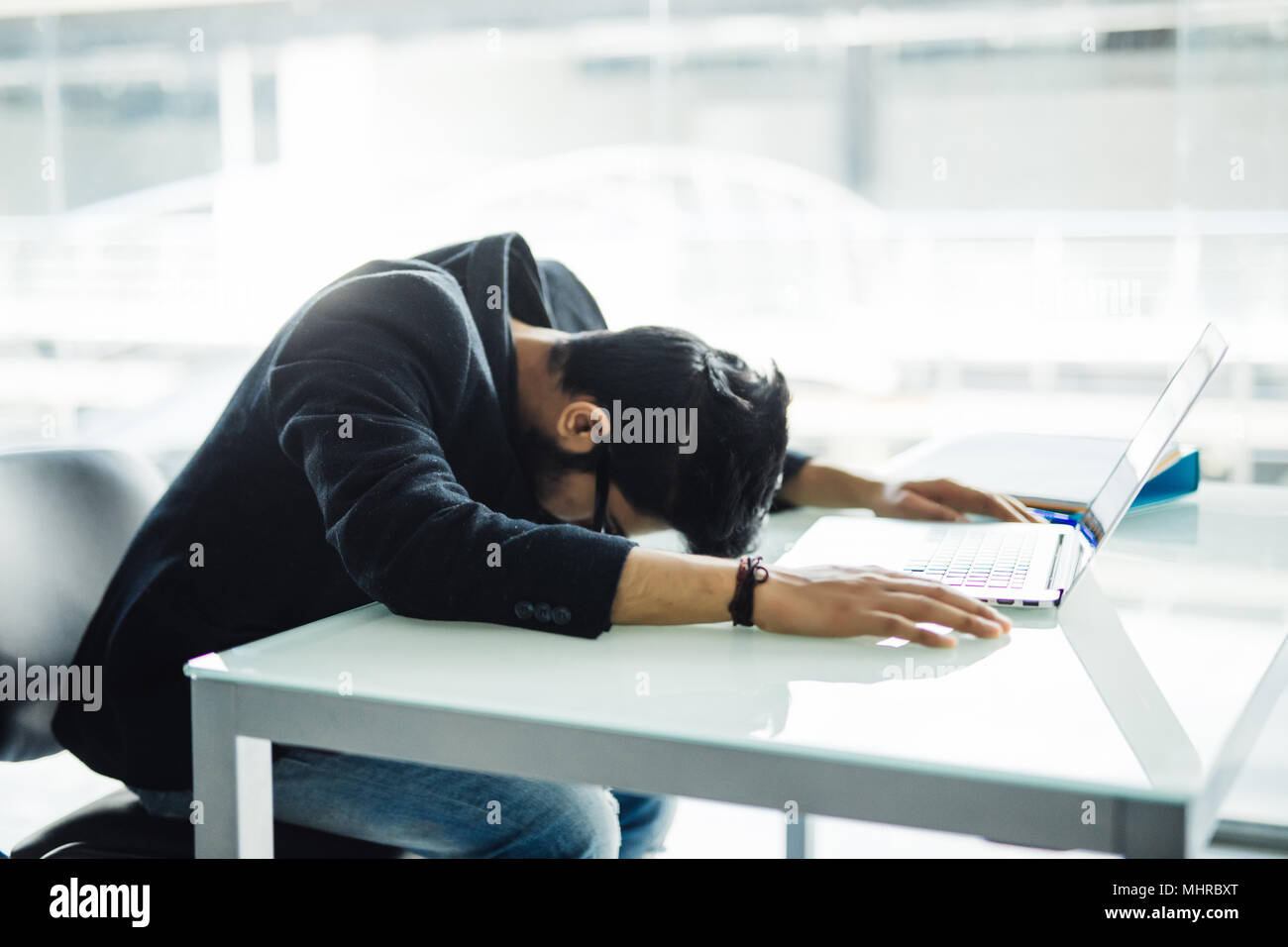 Indian businessman sleeping in office hi-res stock photography and ...