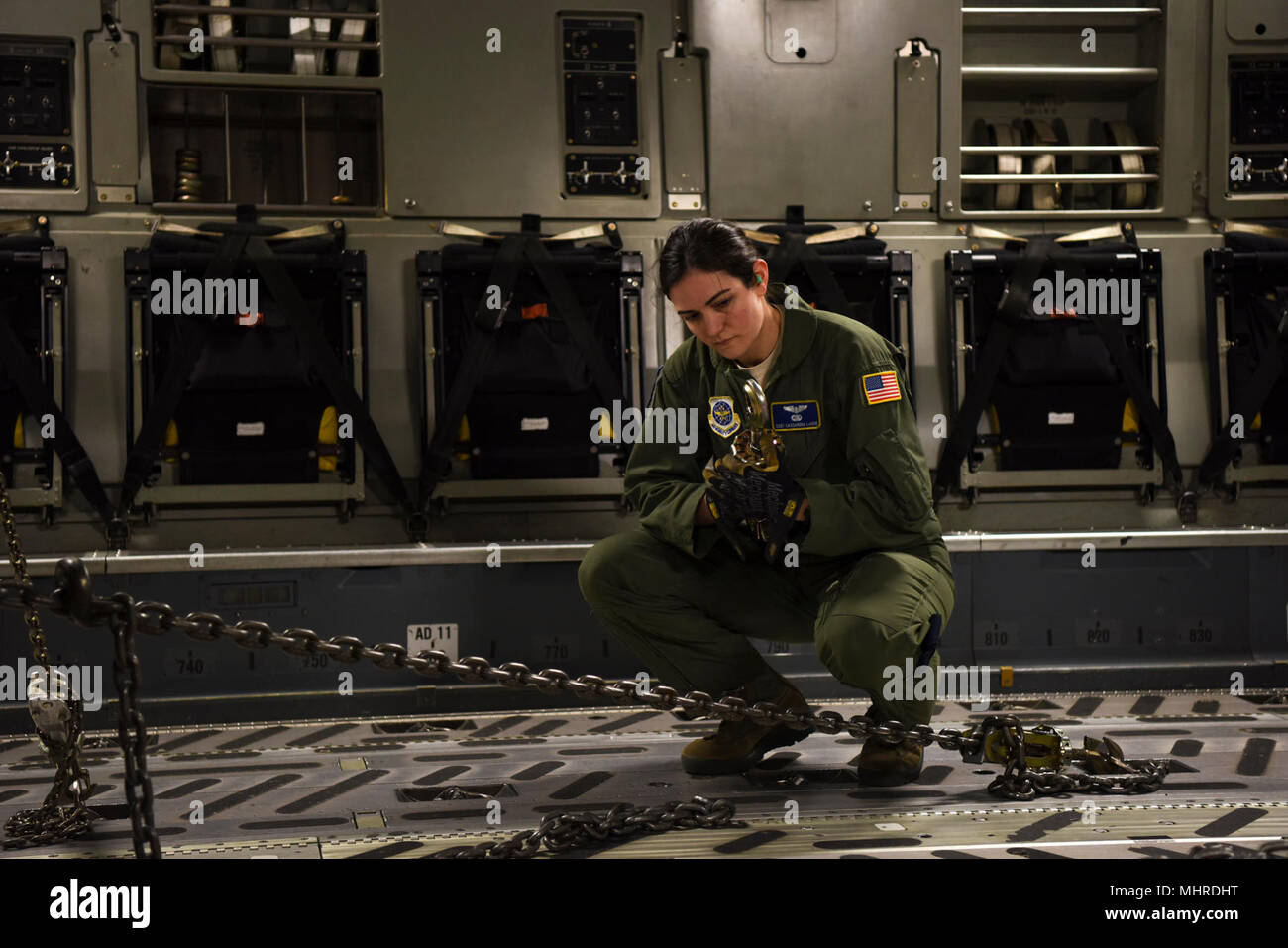 Staff Sgt. Cassandra LaVoie, 3rd Airlift Squadron loadmaster, checks ...