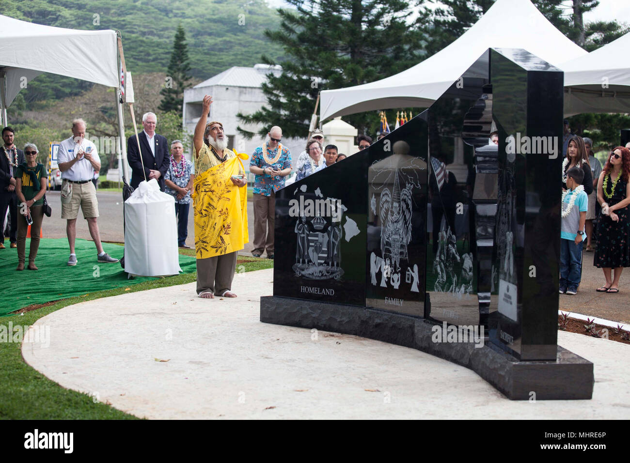 Kahu Arron Mahi, a Hawaiian priest, conducts a blessing with water and ...