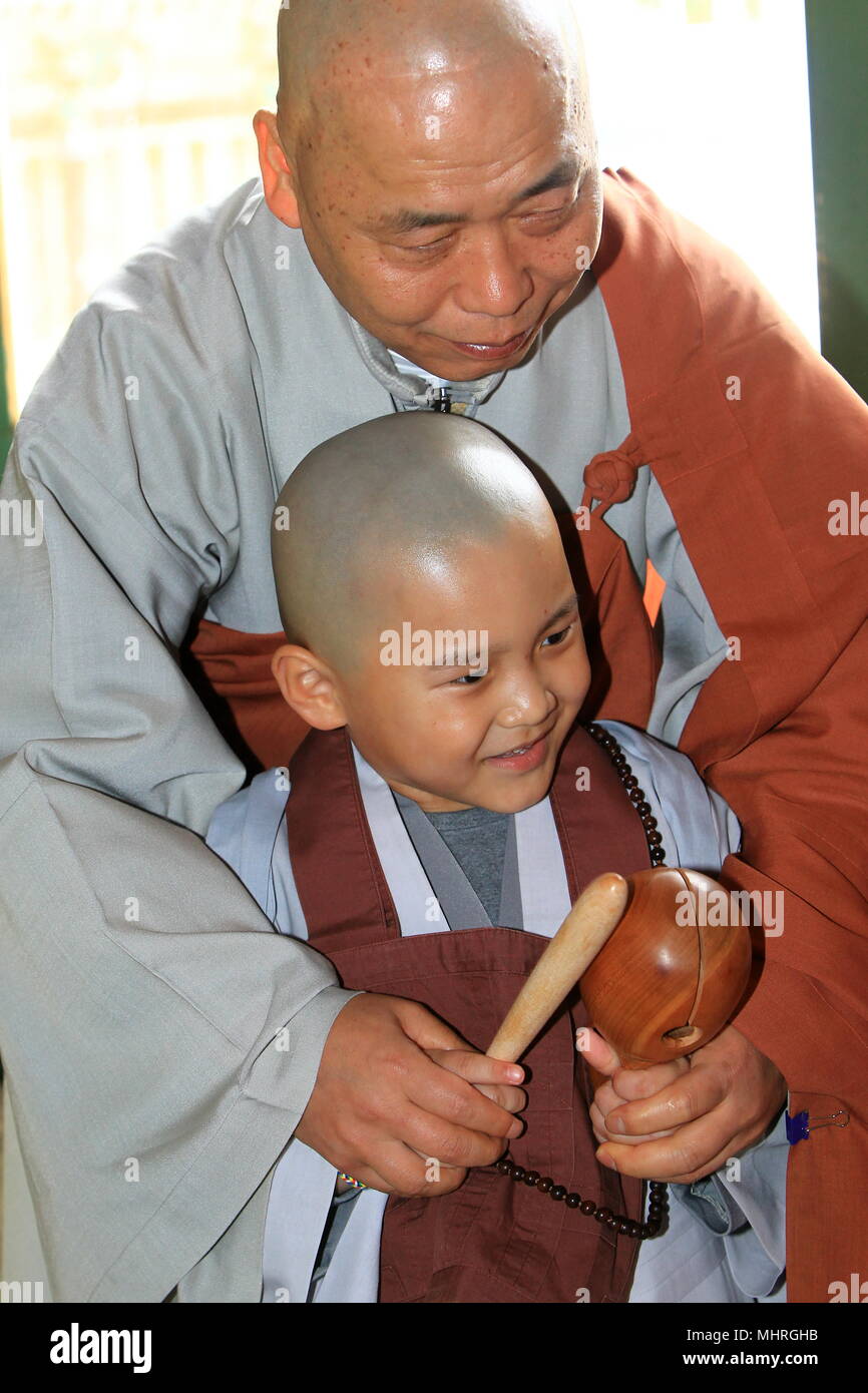 03rd May, 2018. Child monk at Buddhist initiation ceremony A young monk ...