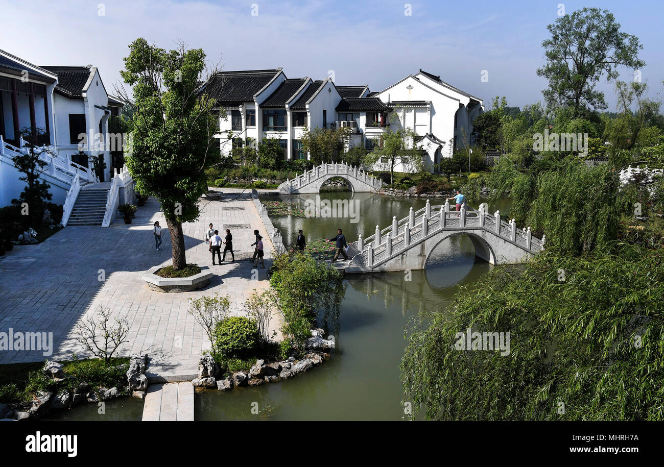 Lu'an, China's Anhui Province. 3rd May, 2018. Tourists visit a small ...