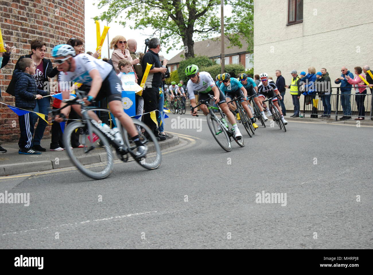 Doncaster, UK, 3rd May, 2018. Cyclists round the corner in Hatfield in ...