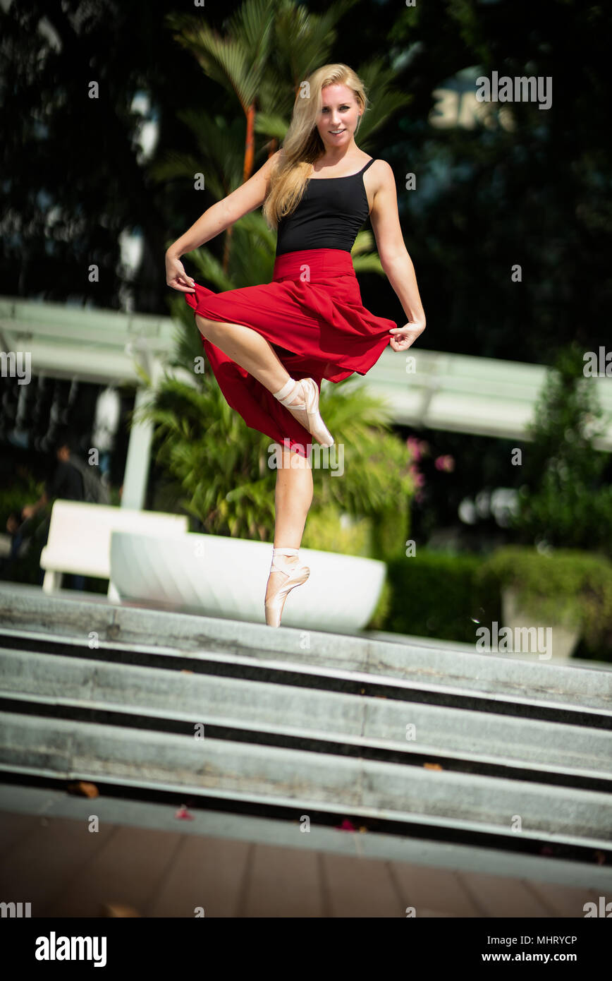 Beautiful Young Girl Dancing on a bridge Stock Photo - Alamy