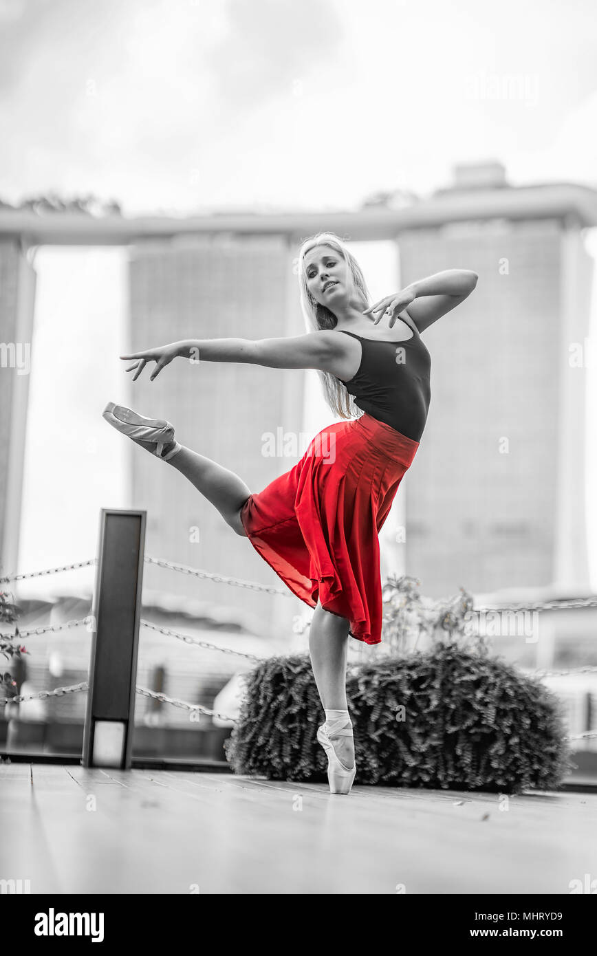 Beautiful Young Girl Dancing on a bridge Stock Photo - Alamy