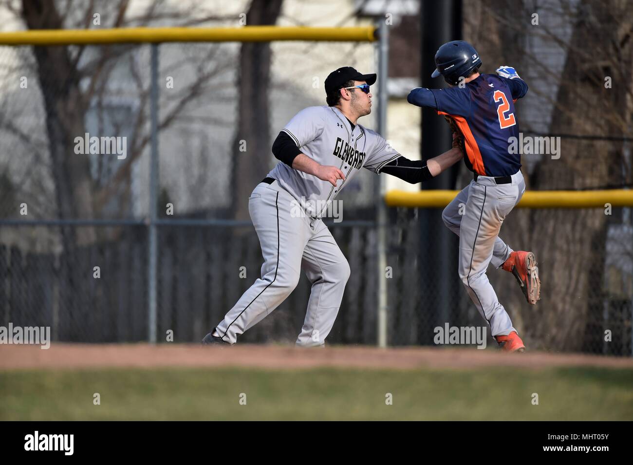 First baseman coming off the bag to accept a throw from across the ...