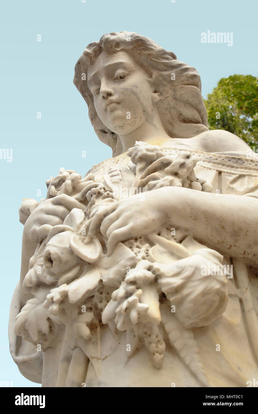 A statue of an angel looks down as if to guard and protect Stock Photo ...