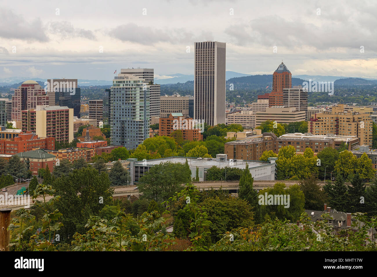 Portland Oregon downtown cityscape by freeway nestled among trees Stock ...