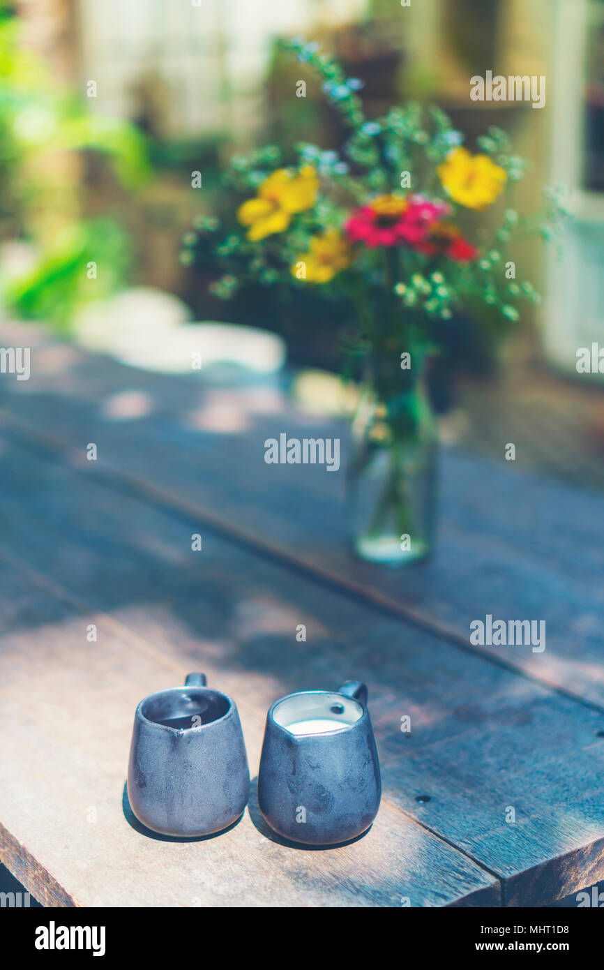 milk and syrup on cafe table Stock Photo - Alamy