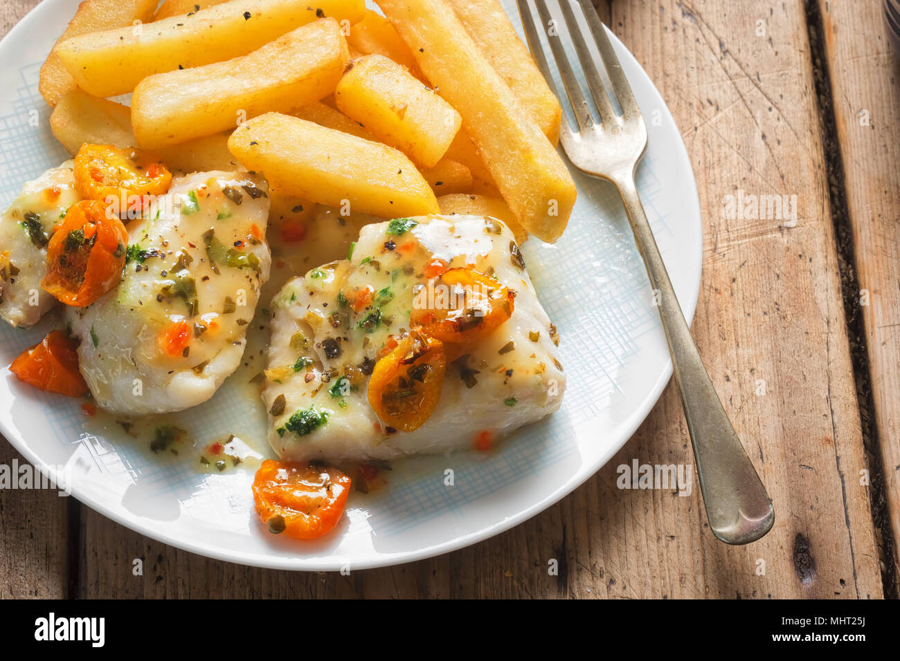 Cod fillets with cherry tomato, white wine & basil dressing served with ...