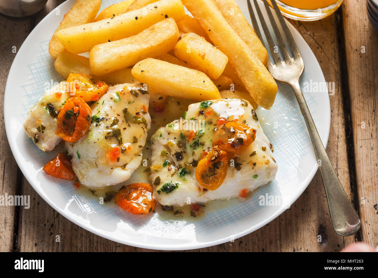 Cod fillets with cherry tomato, white wine & basil dressing served with ...