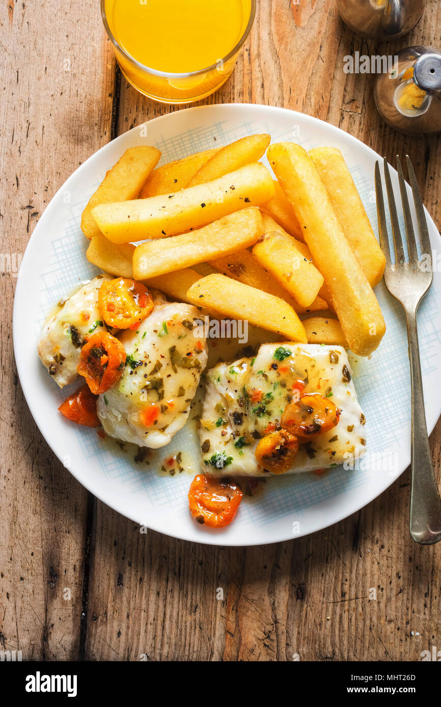 Cod fillets with cherry tomato, white wine & basil dressing served with ...