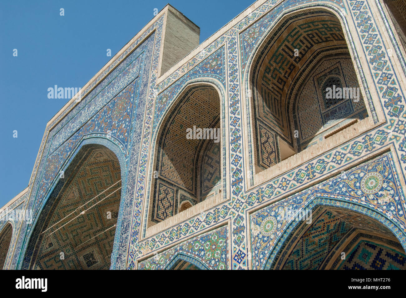 The arch and the exterior design of the ancient Registan in Samarkand ...