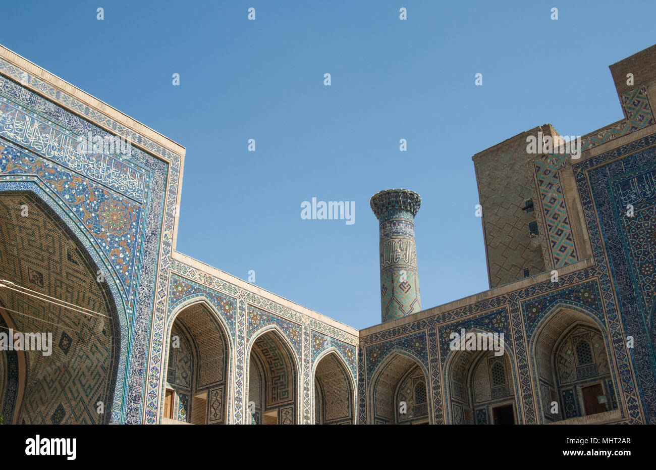 The arch and the exterior design of the ancient Registan in Samarkand ...