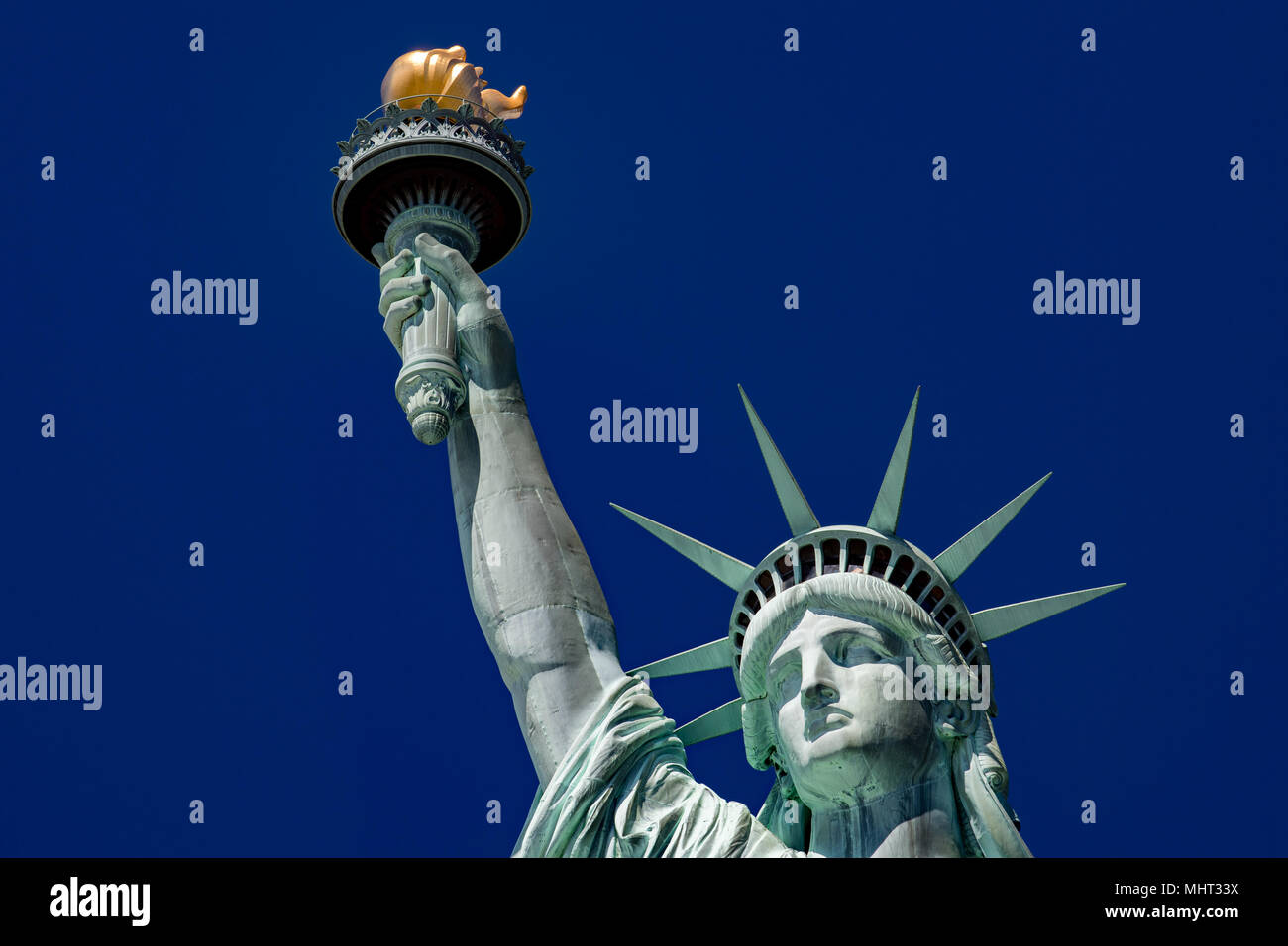 Statue of liberty on blue sky background Stock Photo - Alamy
