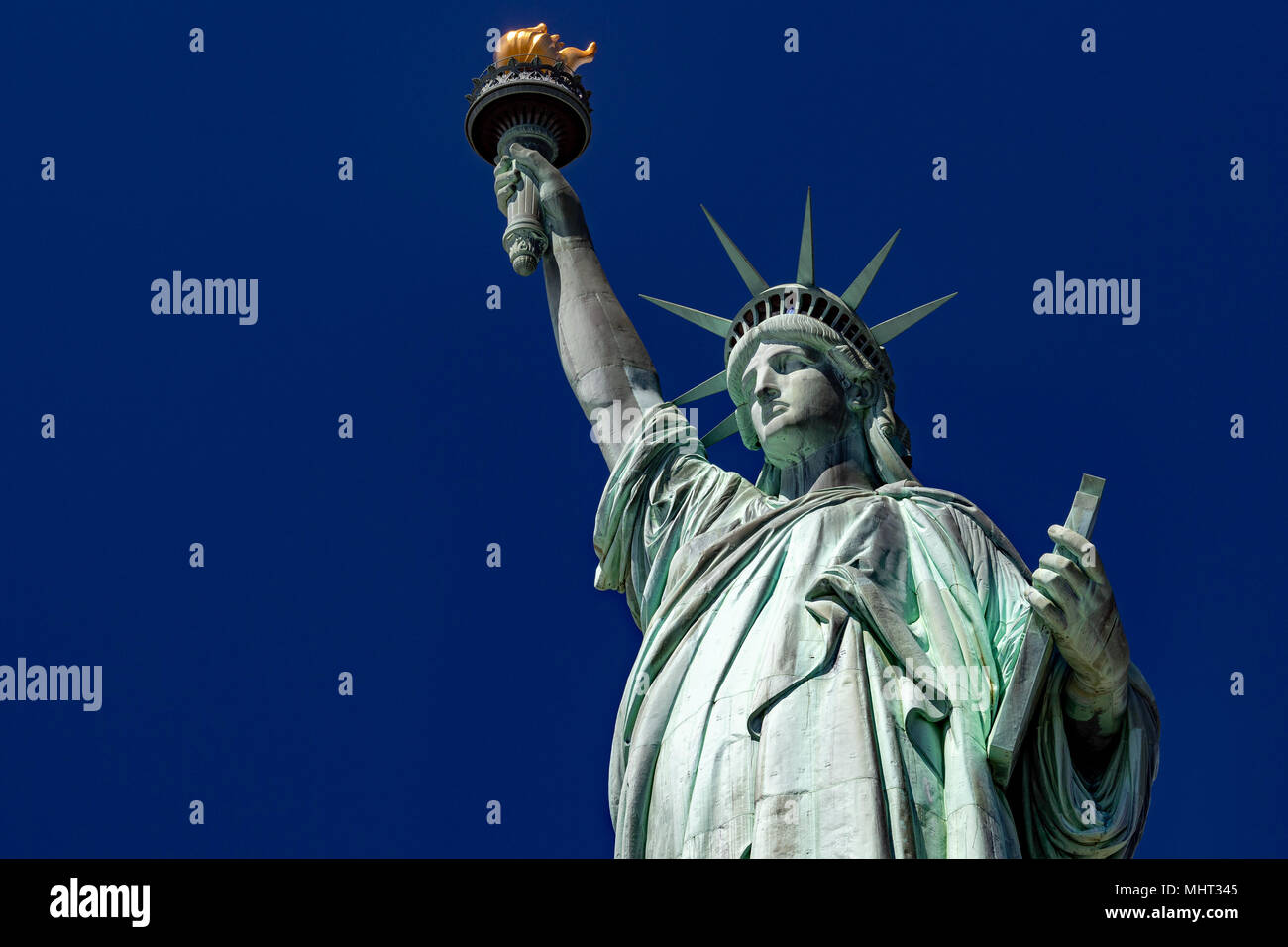 Statue of liberty on blue sky background Stock Photo - Alamy