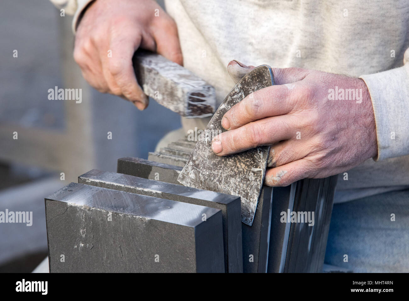 Hands of sculptor carving stone hi-res stock photography and images - Alamy