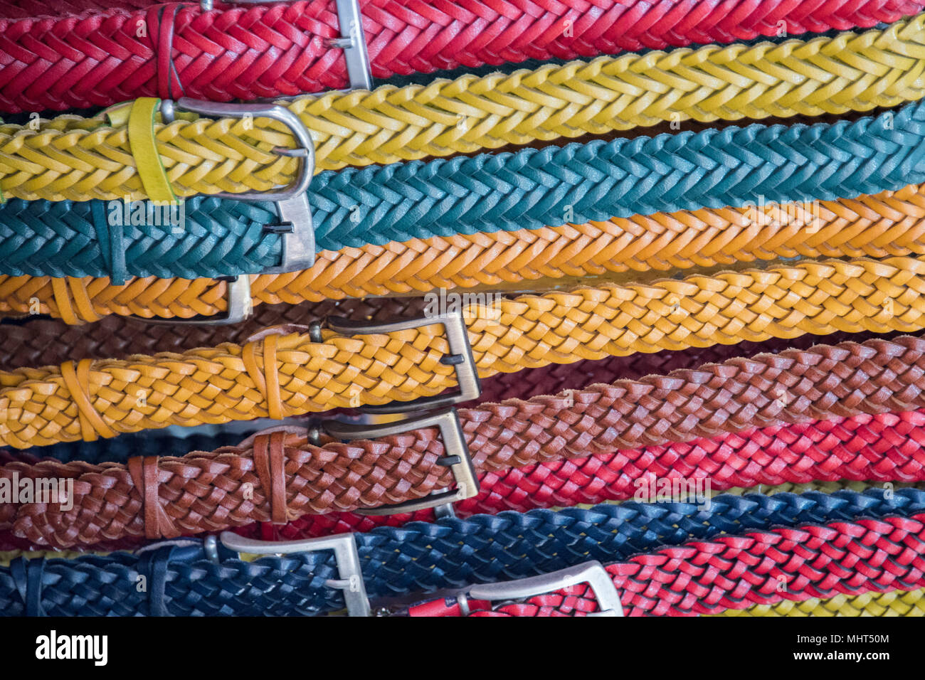 different colors leather belt on display Stock Photo - Alamy