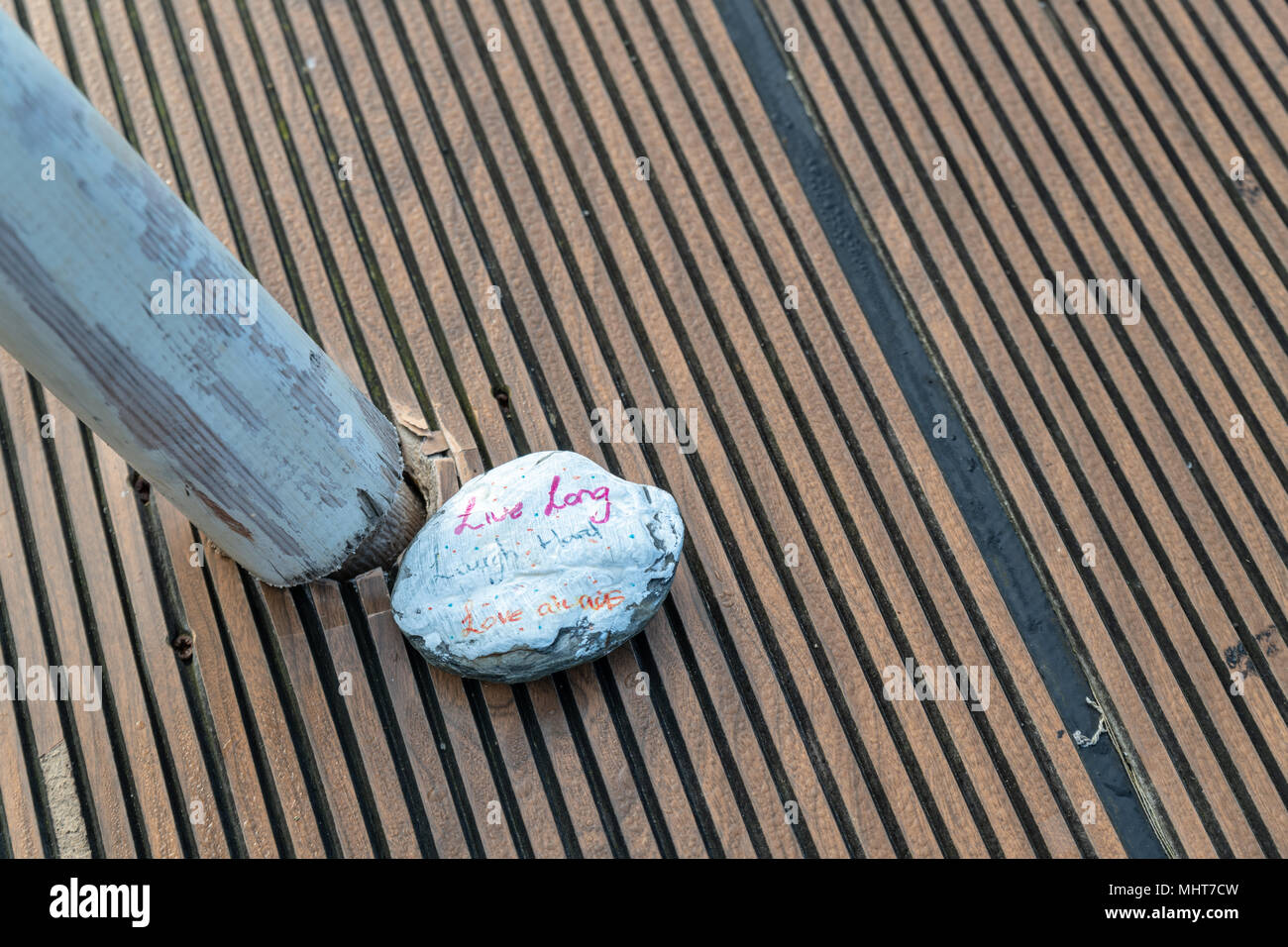 Painted pebble with message Stock Photo - Alamy