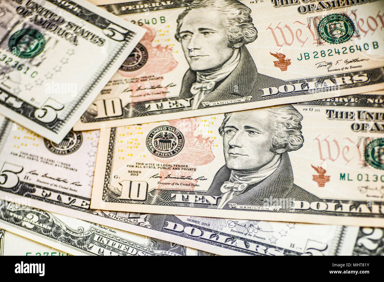 Dollar bills of different denominations background Stock Photo - Alamy