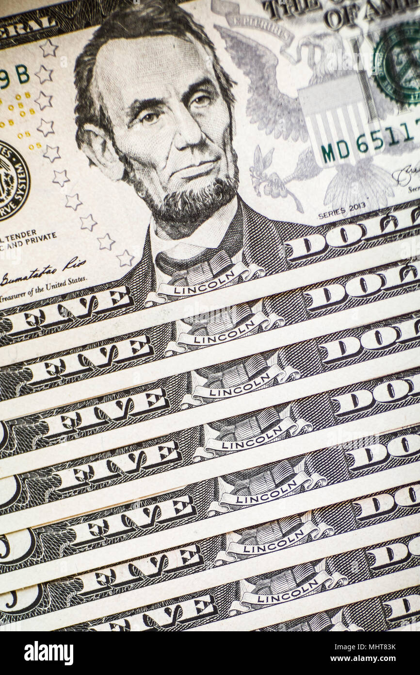 Dollar bills of different denominations background Stock Photo - Alamy