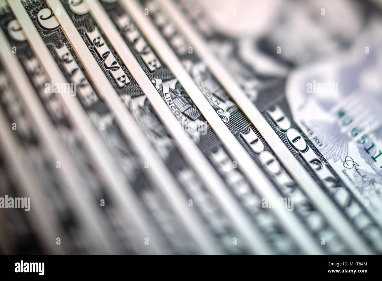 Dollar bills of different denominations background Stock Photo - Alamy