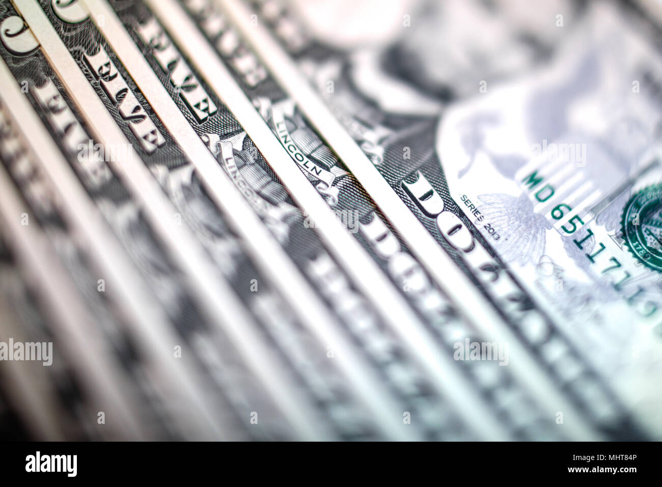 Dollar bills of different denominations background Stock Photo - Alamy