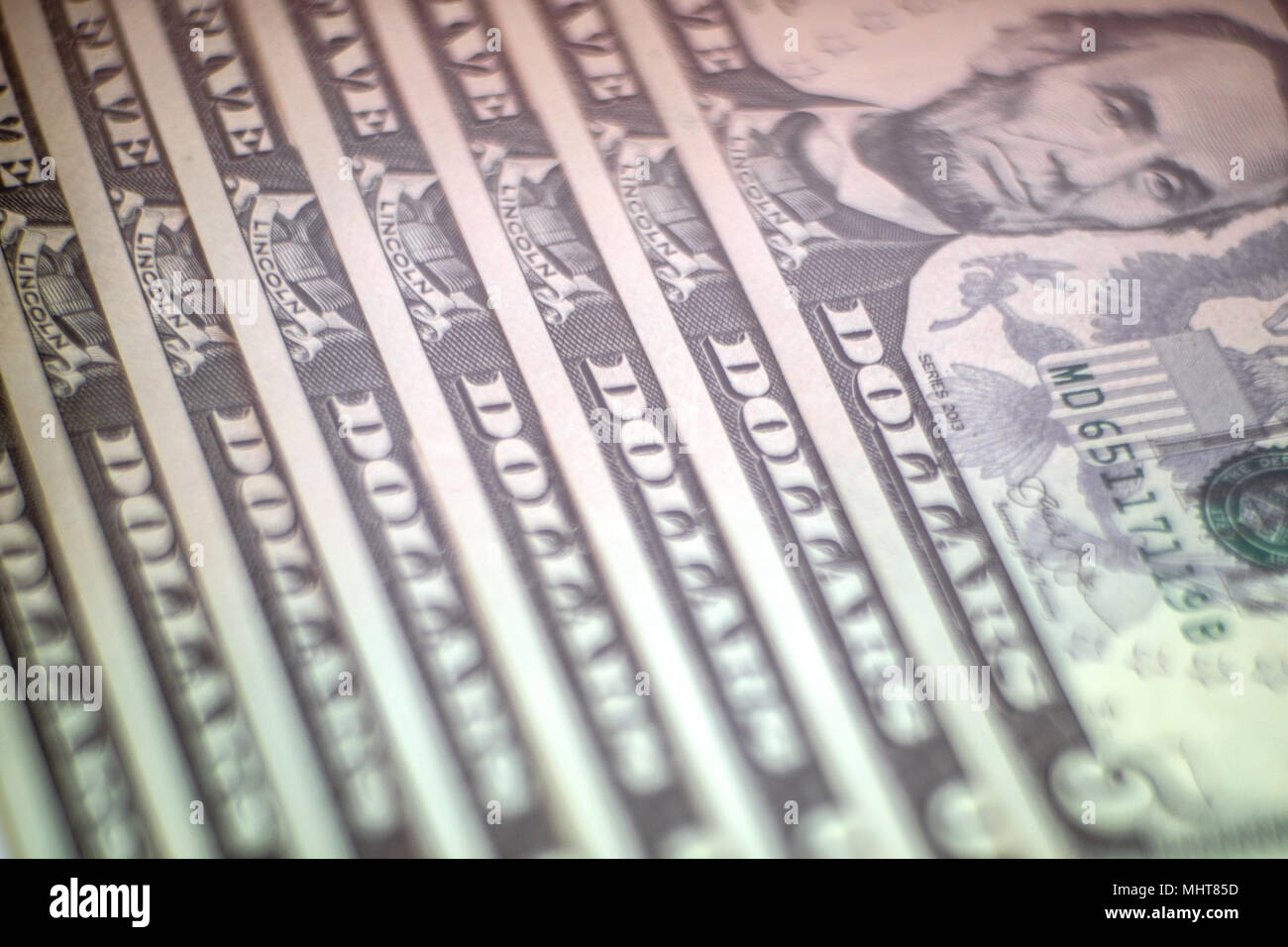 Dollar bills of different denominations background Stock Photo - Alamy