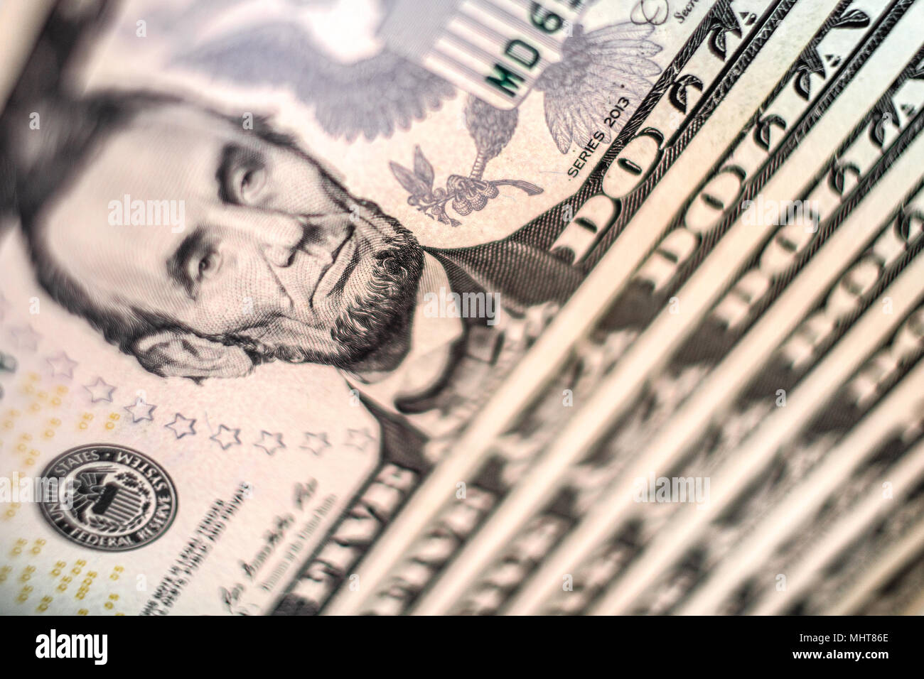 Dollar bills of different denominations background Stock Photo - Alamy